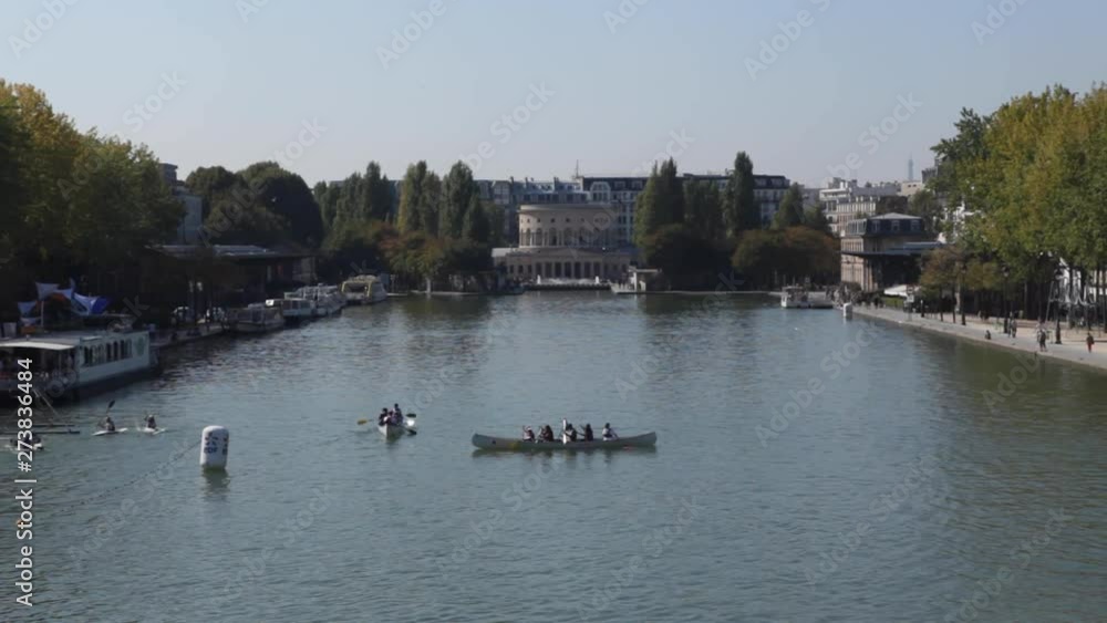 Paris, France - April 5, 2019: Parisian basin with people canoeing ...