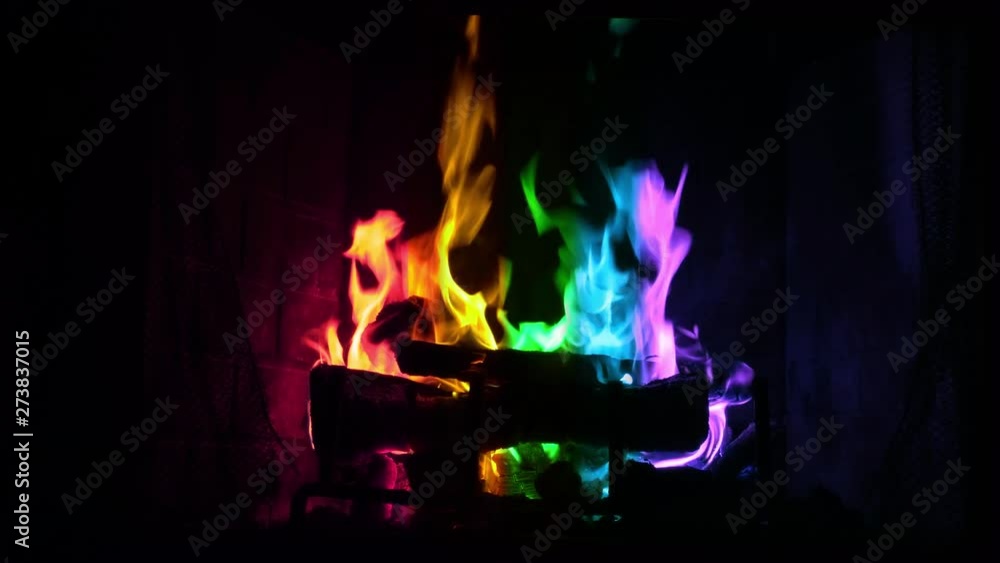A Rainbow fireplace flames brightly in stunning 4K. Colors of Red ...