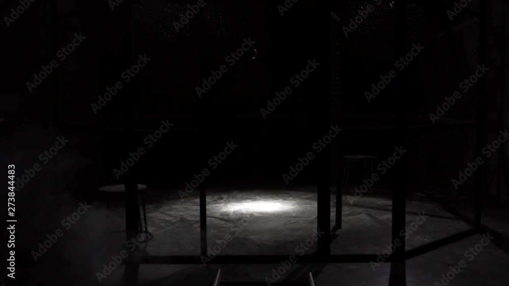 White smoke Projection in a metal grilles cage, circular MMA boxing ...