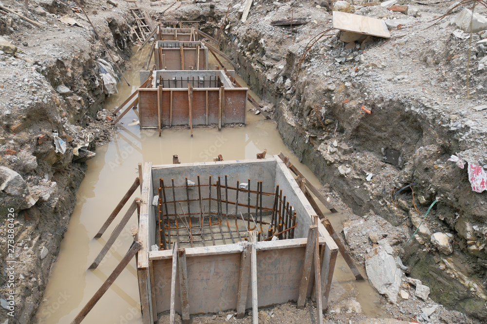 Pile cap and column stump under construction at the construction site ...