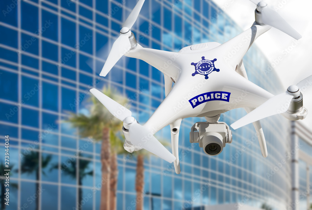 Police Unmanned Aircraft System, (UAS) Drone Flying Near City Highrise ...
