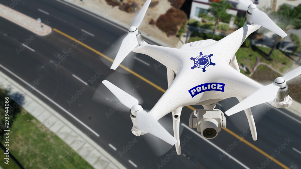 Police Unmanned Aircraft System, (UAS) Drone Flying Above A City Street ...