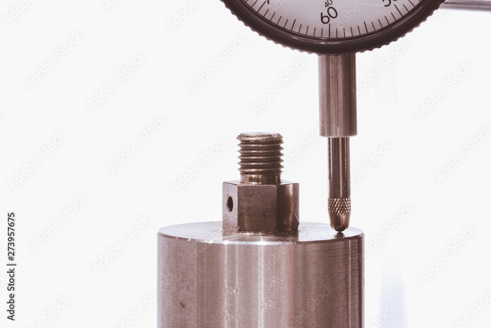 Close up of Dial gauge measure the part after production process to ...