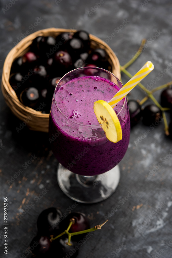 Juice of jamun fruit in a glass also called as java plum, jambolan plum ...