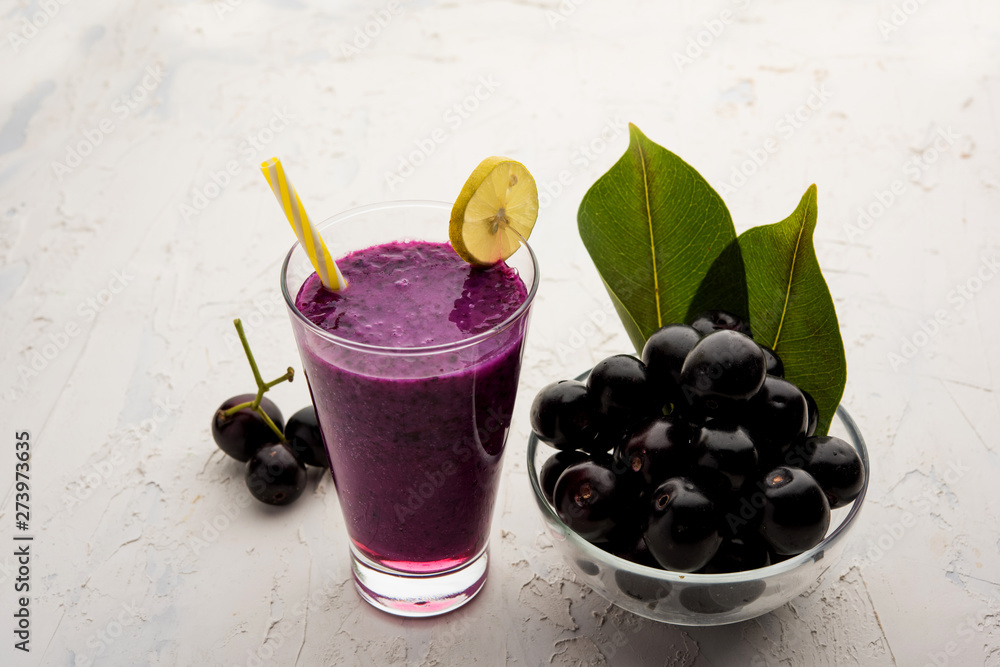 Juice of jamun fruit in a glass also called as java plum, jambolan plum ...