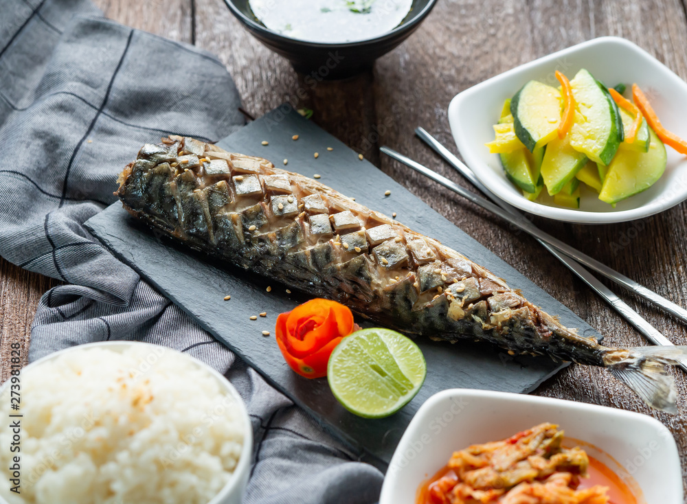 One set of saba grill serve with slide dish, kimchi, rice and seaweed ...