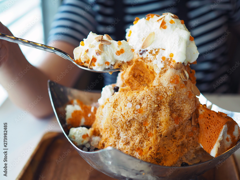 Scoop Thai Tea Shaved Ice served with cube bread, whipped cream, white ...