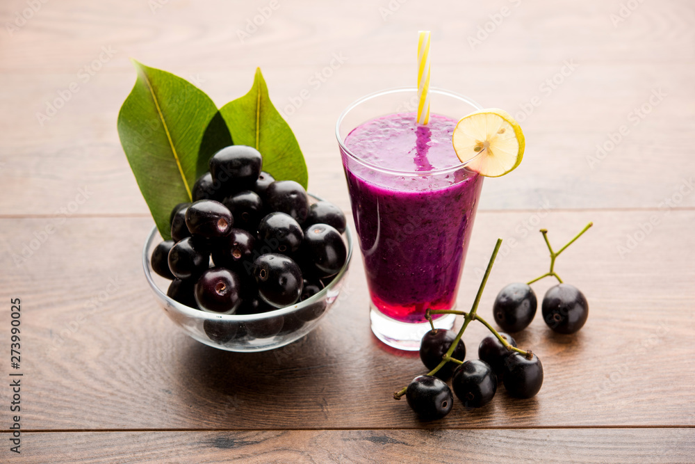 Juice of jamun fruit in a glass also called as java plum, jambolan plum ...