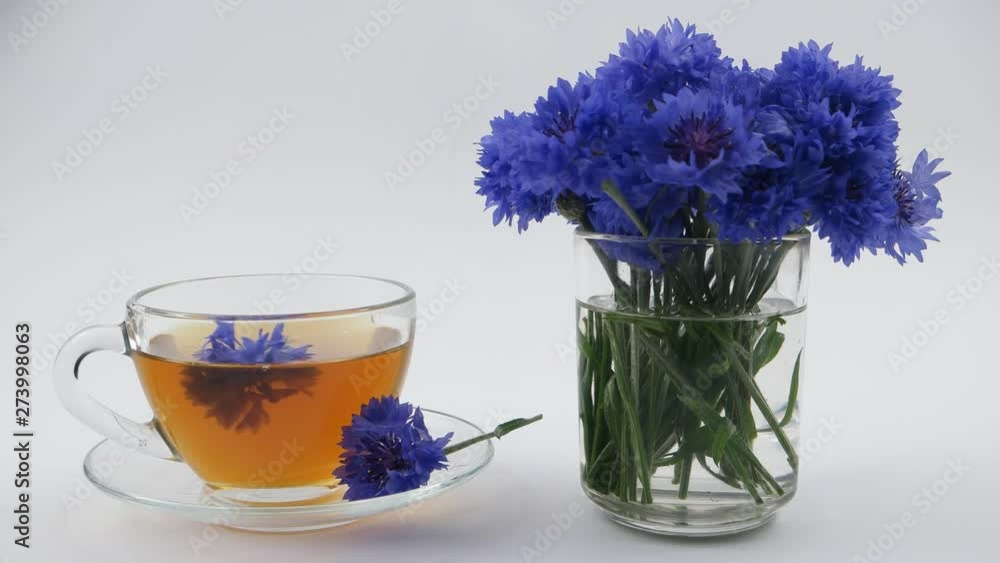 The cup of hot herbal tea of calendula, chamomile and cornflower ...