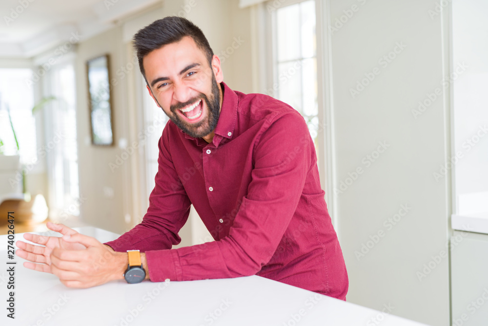 Handsome man smiling cheerful with a big smile on face showing teeth ...