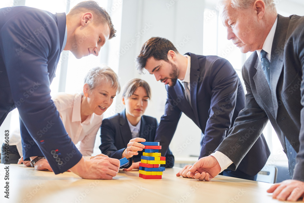 Business people make building blocks exercise Stock Photo | Adobe Stock