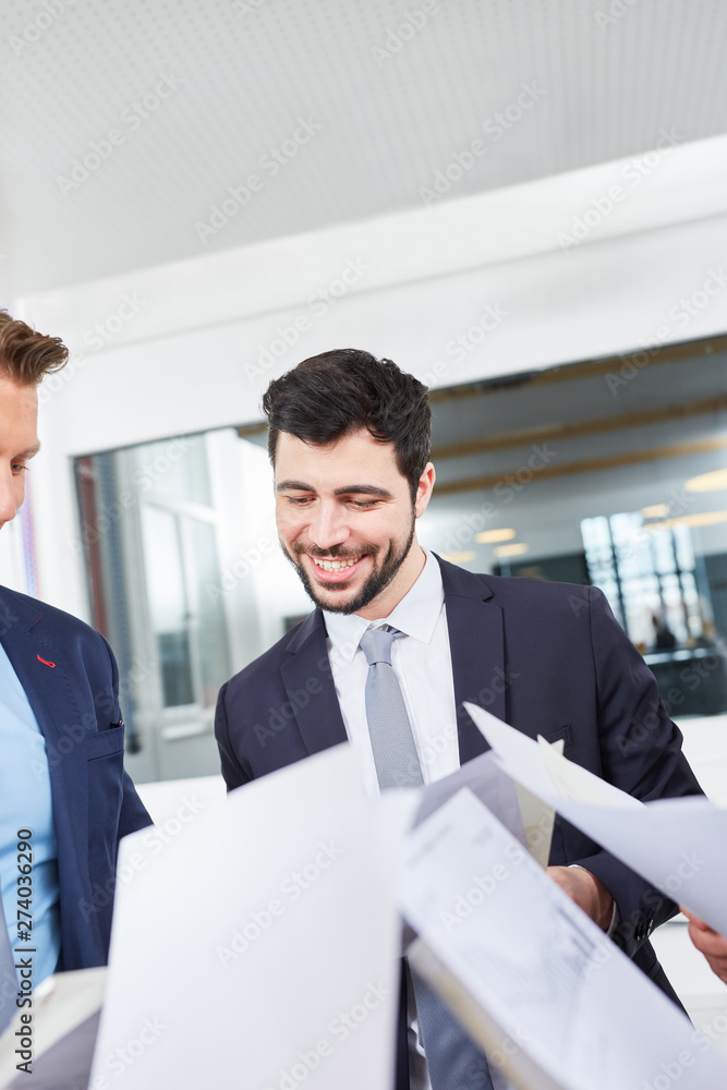 Manager in start-up checking documents Stock Photo | Adobe Stock