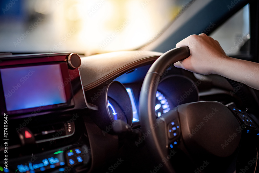 Male driver hand holding on steering wheel using digital dashboard ...