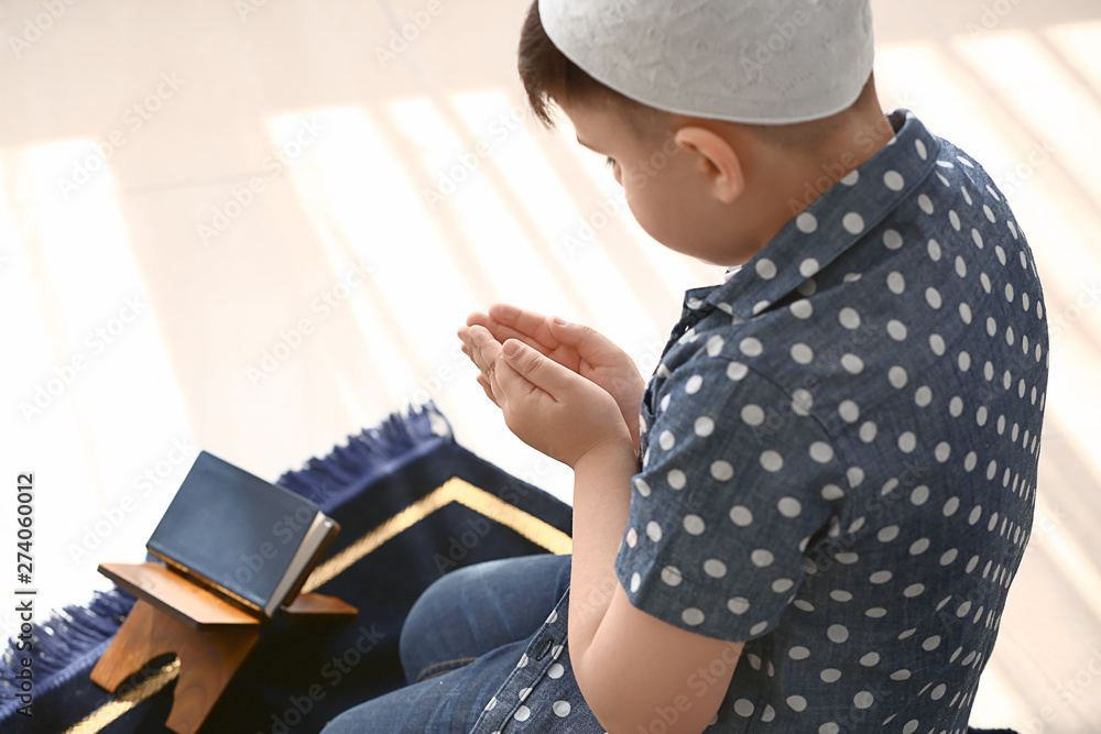 Little Muslim boy praying indoors Stock Photo | Adobe Stock