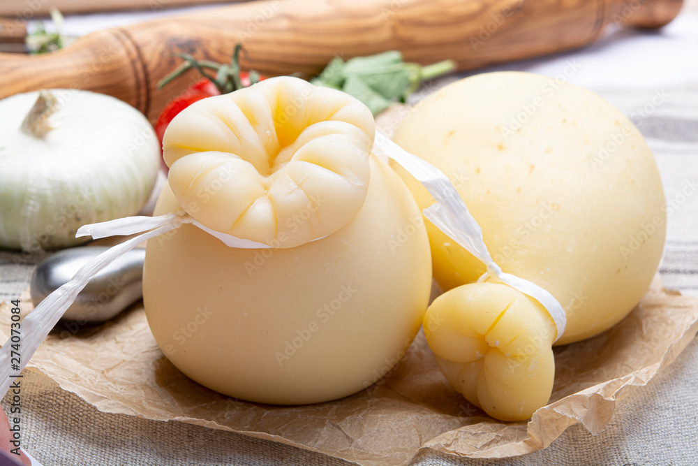 Foto de Italian provolone or provola caciocavallo hard cheeses in ...
