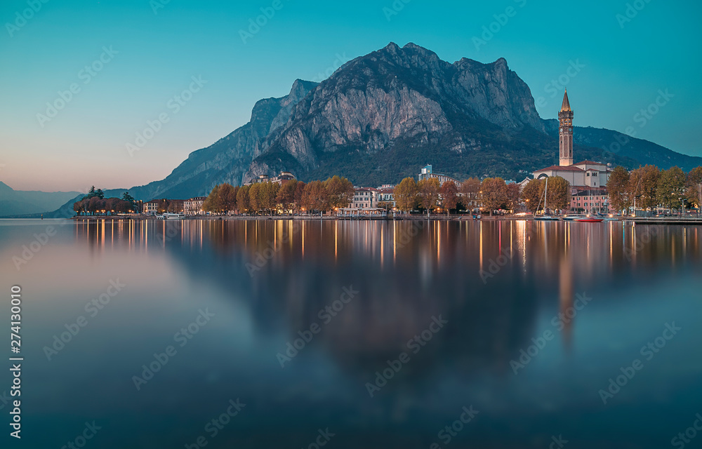 Poster The city of Lecco on Lake Como with reflections in the water ...