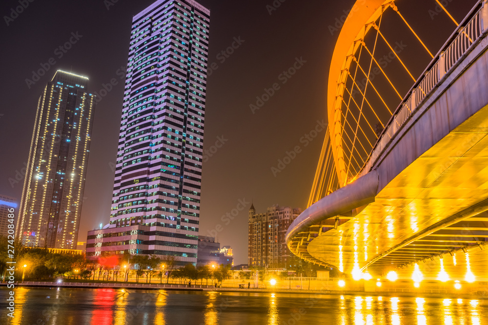 Tianjin Hai river waterfront downtown skyline with illuminated Dagu ...