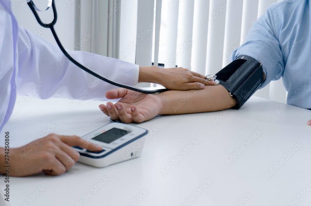 Poster Doctor checking old woman patient arterial blood pressure ...