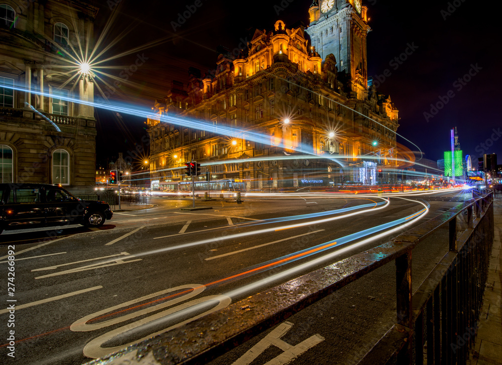 Streets of Edinburgh, Scotland, at night with light trails of street ...