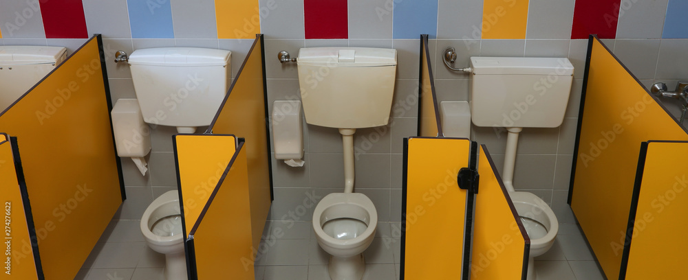 three small toilet in the bathroom of a preschool Stock Photo | Adobe Stock