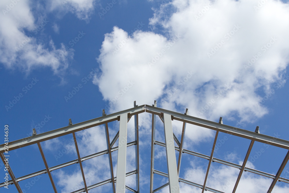 The structure of the building. Steel construction on the sky background ...