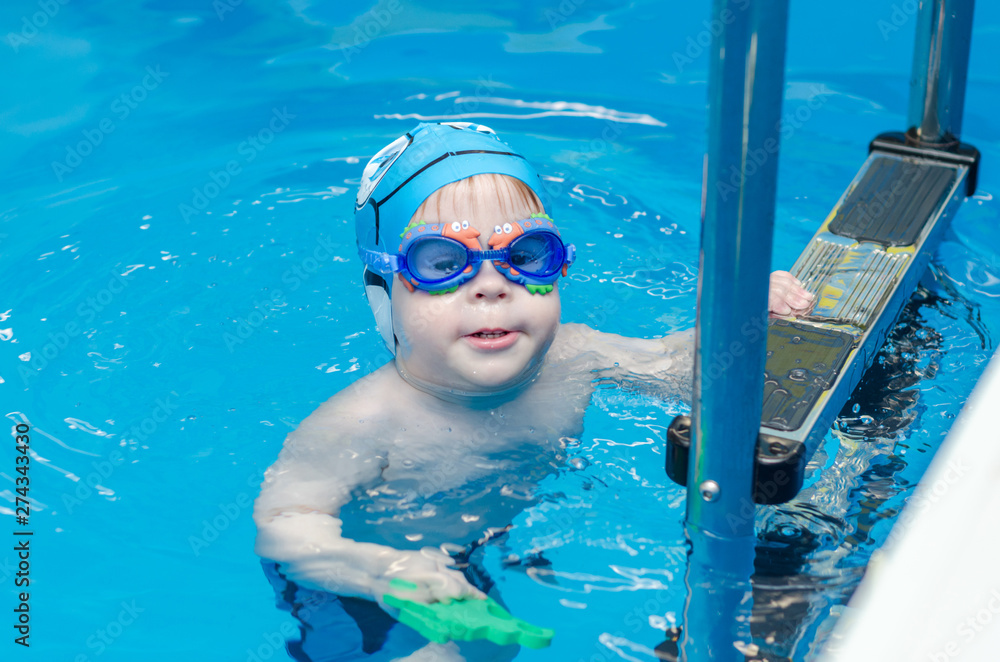 child swimming in the pool Stock Photo | Adobe Stock