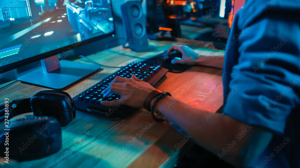 Close-Up Hands Shot Showing a Gamer Using the Keyboard while Playing an ...