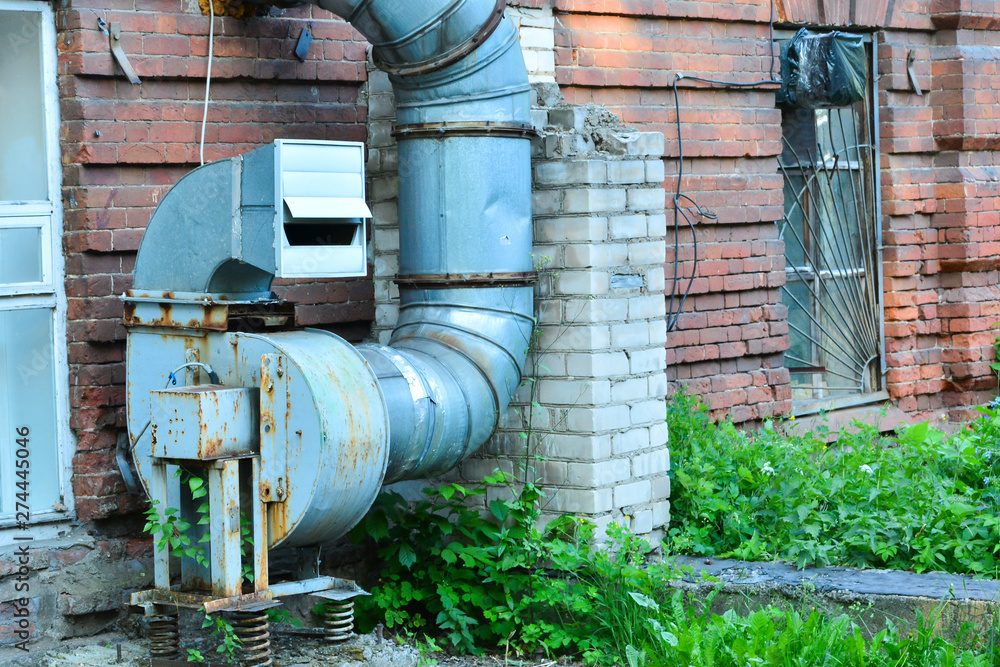 Ventilation of buildings. Side view of an old high-performance ...