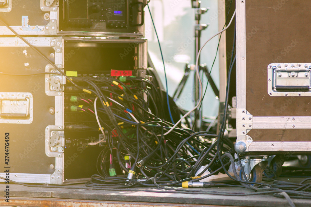 The huge amount of wires mixed up with each other from sound, light and ...