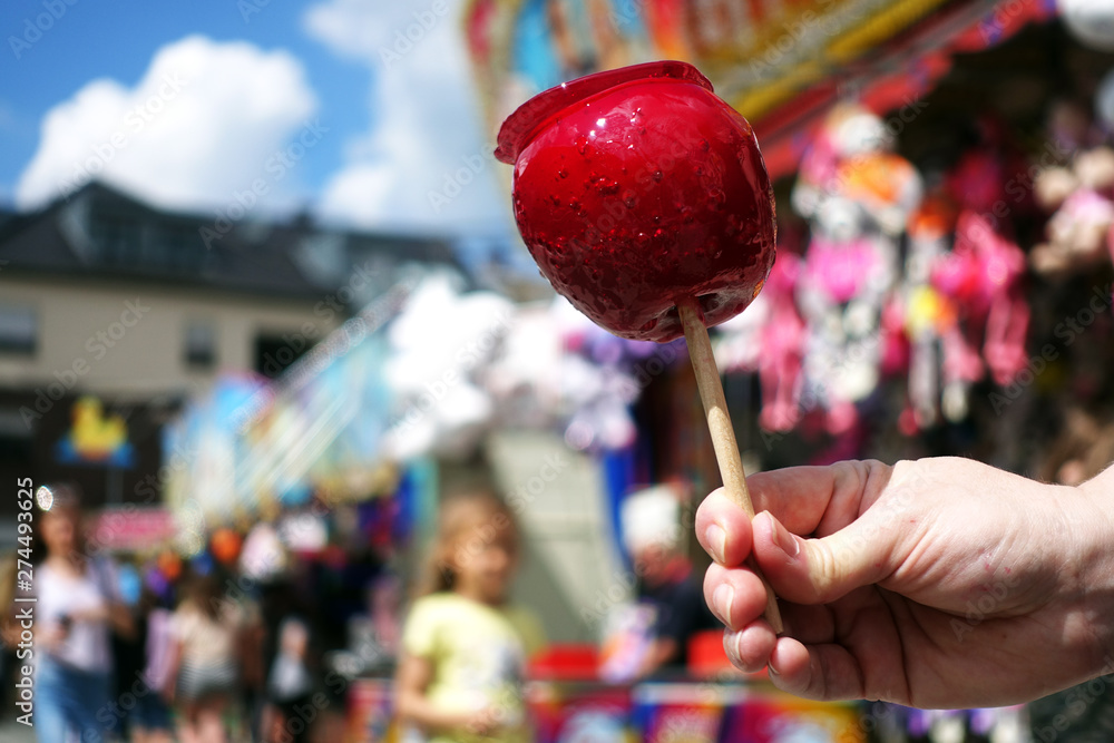 sweet candy apple on county fair or festival. red candy apple covered ...