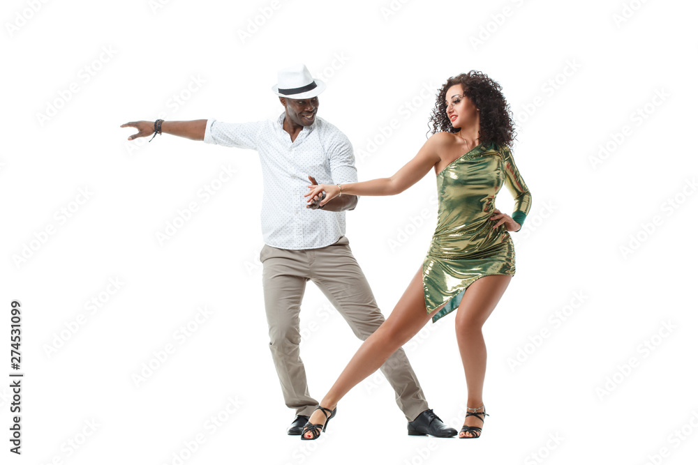 Elegant black man and gorgeous latin girl dancing samba isolated on ...