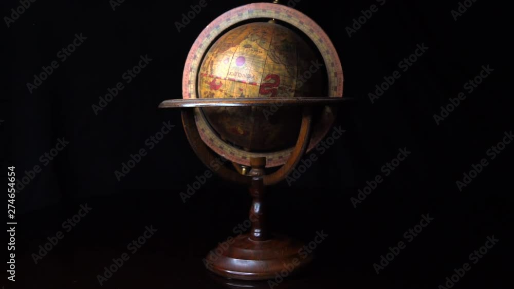 This zooming out video shows a spinning antique medieval old world ...