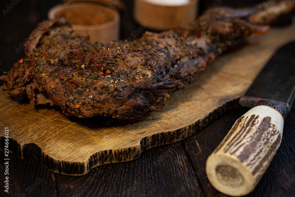 Baked goat leg with spices Stock Photo | Adobe Stock
