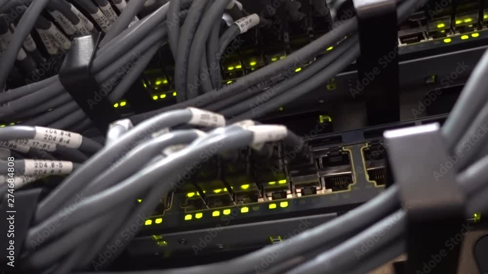 Network switch HUB and ethernet cables LAN in datacenter. The video ...