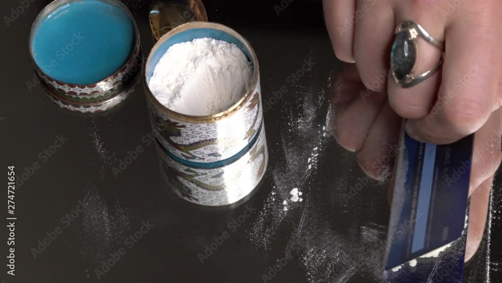This close up top view video shows cocaine being taken out of a fancy ...
