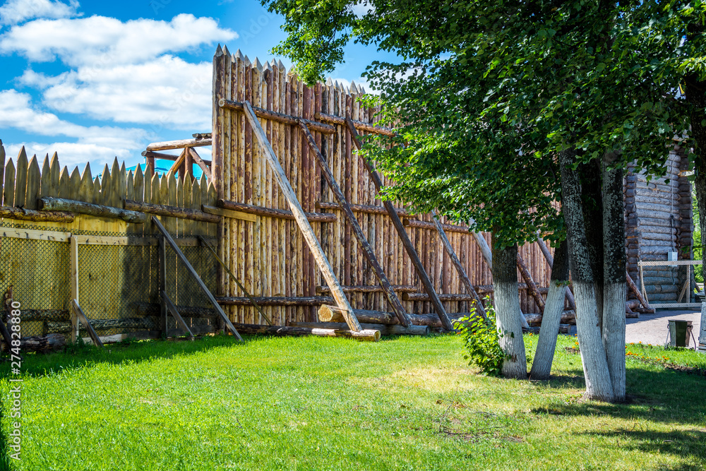 Medieval wooden fence made of palisade Stock Photo | Adobe Stock