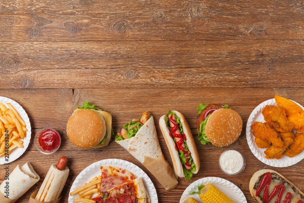 Mix of fast food, street dishes. Background with copy space. Top view ...