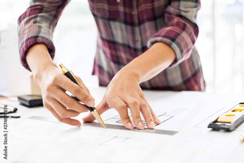 Construction and building concept. Engineers or architect holding a pen ...