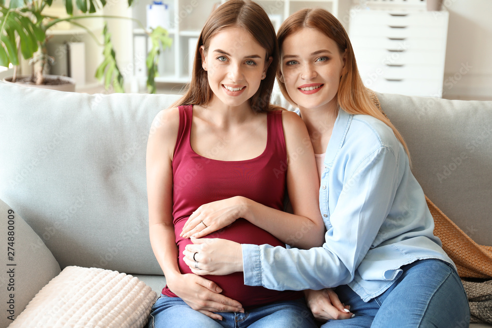 Happy pregnant lesbian couple at home Stock Photo | Adobe Stock