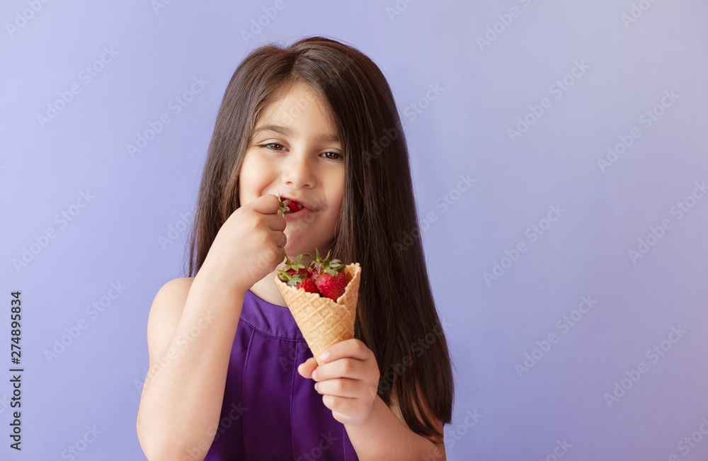 Cute little child girl eting strawberry. Vitamin healthy food. Summer ...