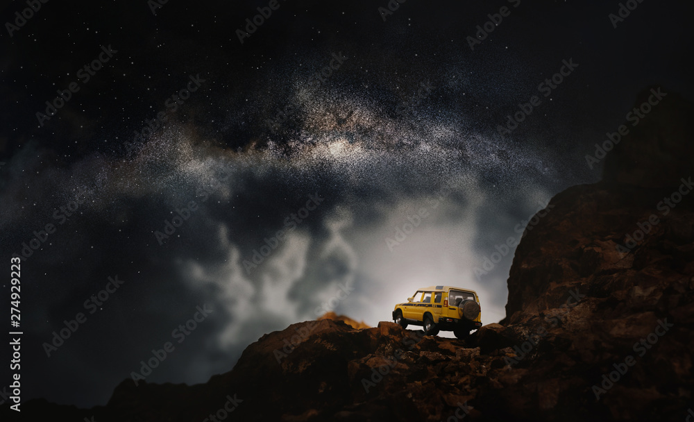 Four by four off road car crossing through the country road against the ...