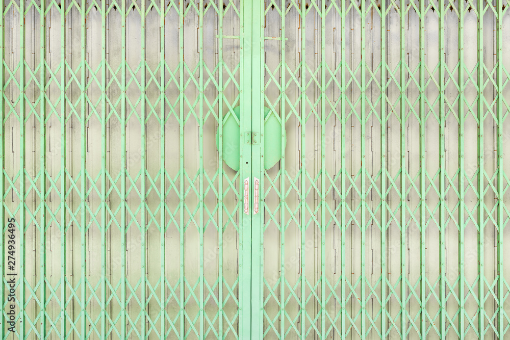 Green stretched slide steel airy door at outside with steel sheet lock ...