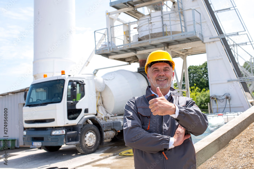 Smiling concrete mixer truck driver with showing thumbs up Stock Photo ...