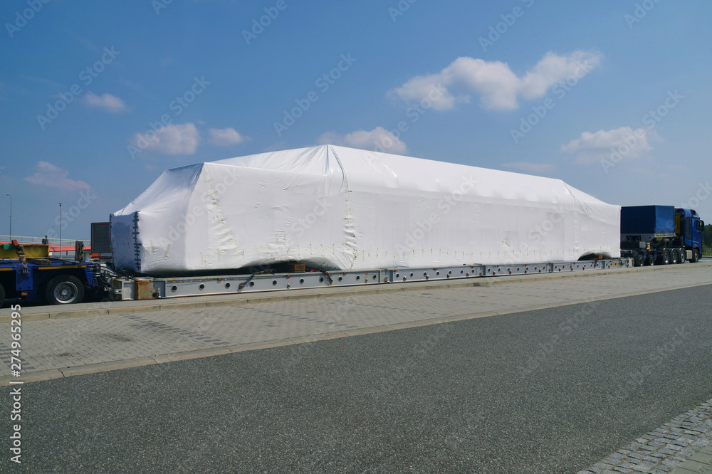 Oversize load or exceptional convoy (convoi exceptionnel). A truck with ...