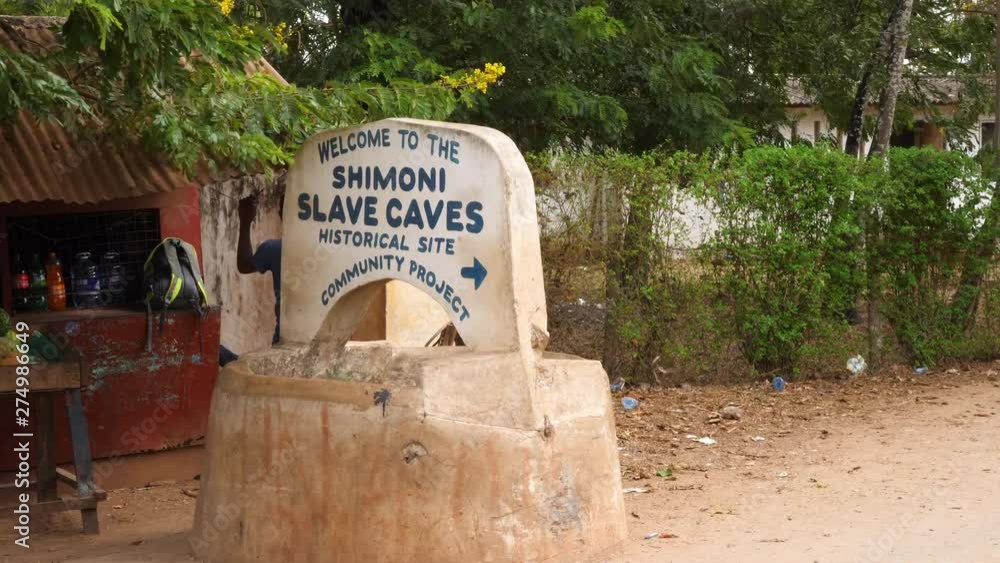 Static shot of the Shimoni slave caves sign, in Kwale, Kenya, Africa 素材 ...