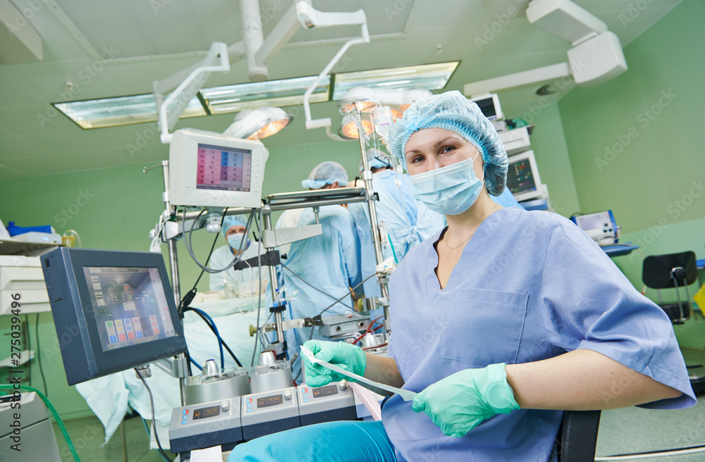 surgery nurse working during operation Stock Photo | Adobe Stock