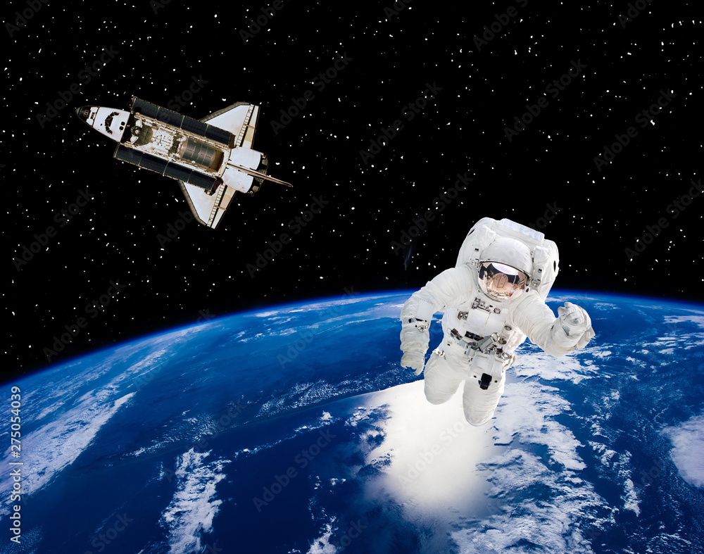 Astronaut above earth and spaceship. The elements of this image ...