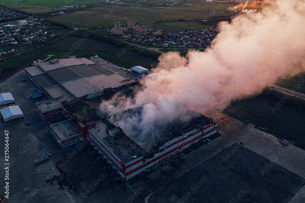 Heavy smoke in burning industrial warehouse or storehouse industrial ...