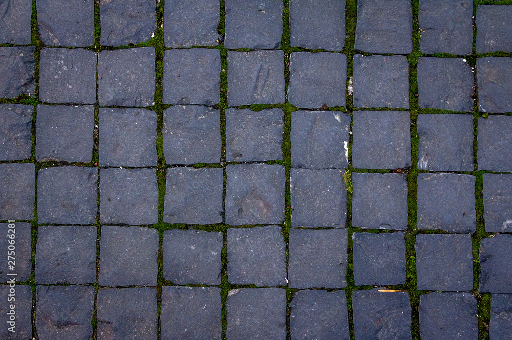 Old cobblestone tile texture in old town. City pavement background ...