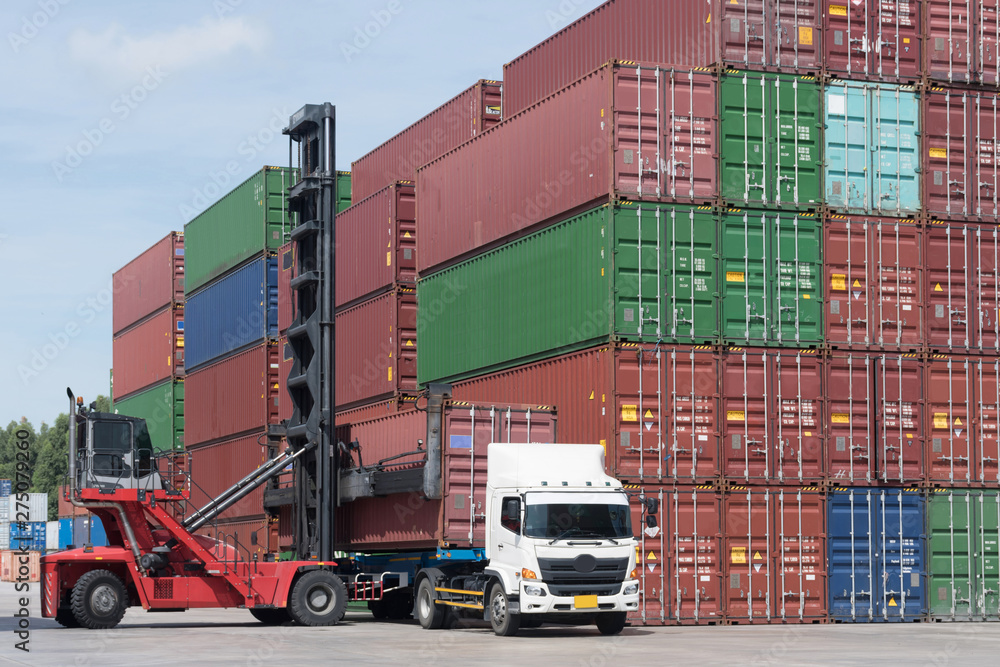 Cargo operation in the port by reach stacker is lifting to derivery ...